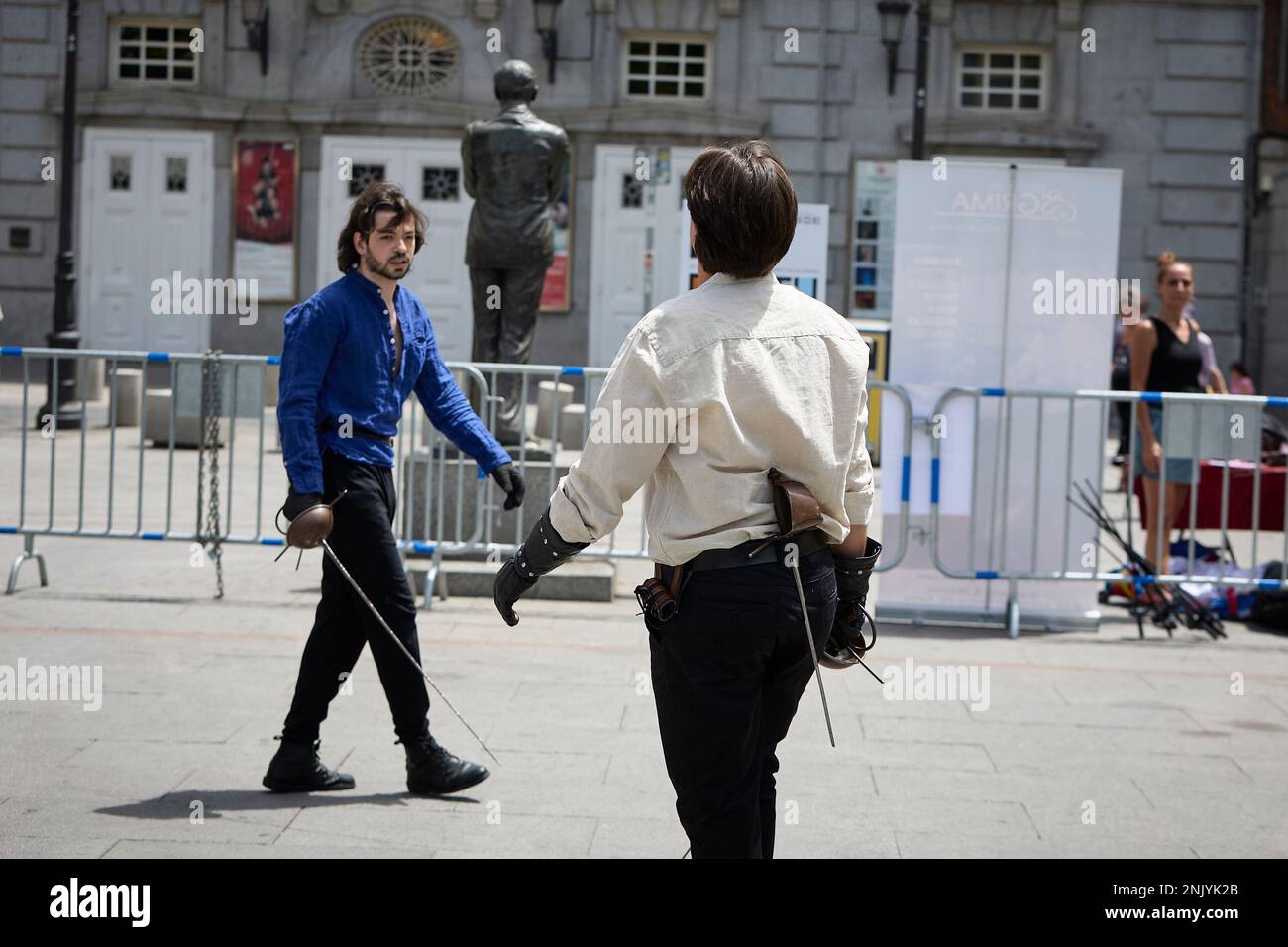 Two fencers practice a bout during a fencing exhibition in the Plaza de ...