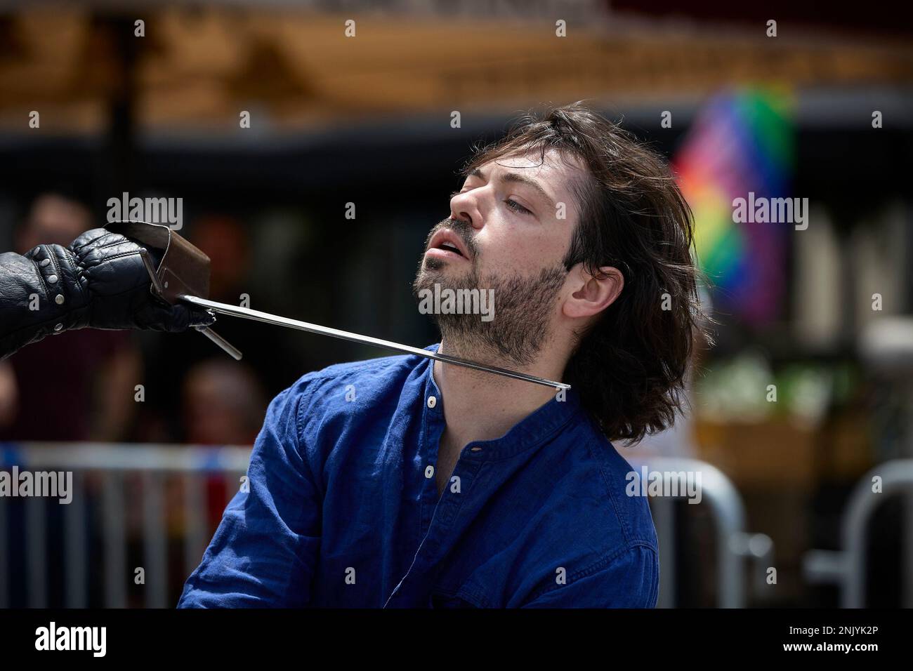 A fencer performs a fencing exhibition in the Plaza de Santa Ana during ...
