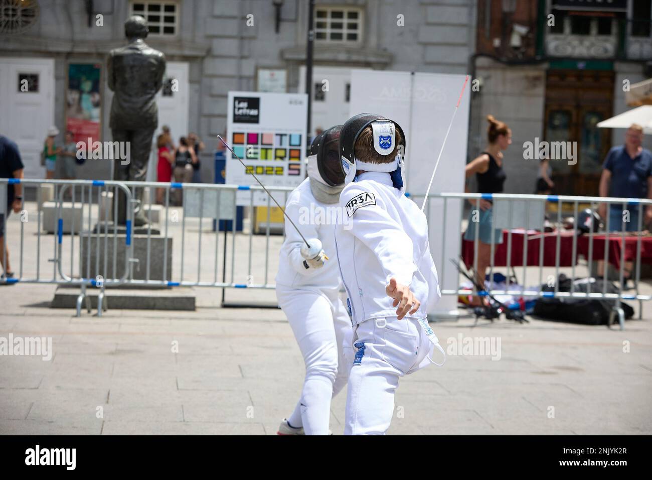 Two fencers practice a bout during a fencing exhibition in the Plaza de ...