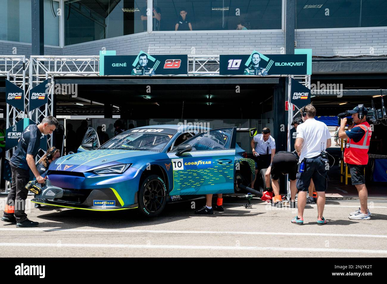 An electric car prepares in the paddock before participating in the ...