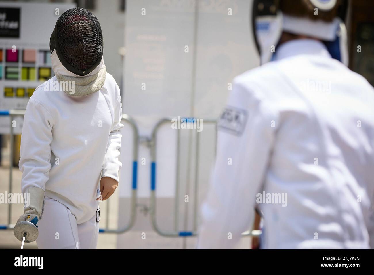 Two fencers practice a bout during a fencing exhibition in the Plaza de ...