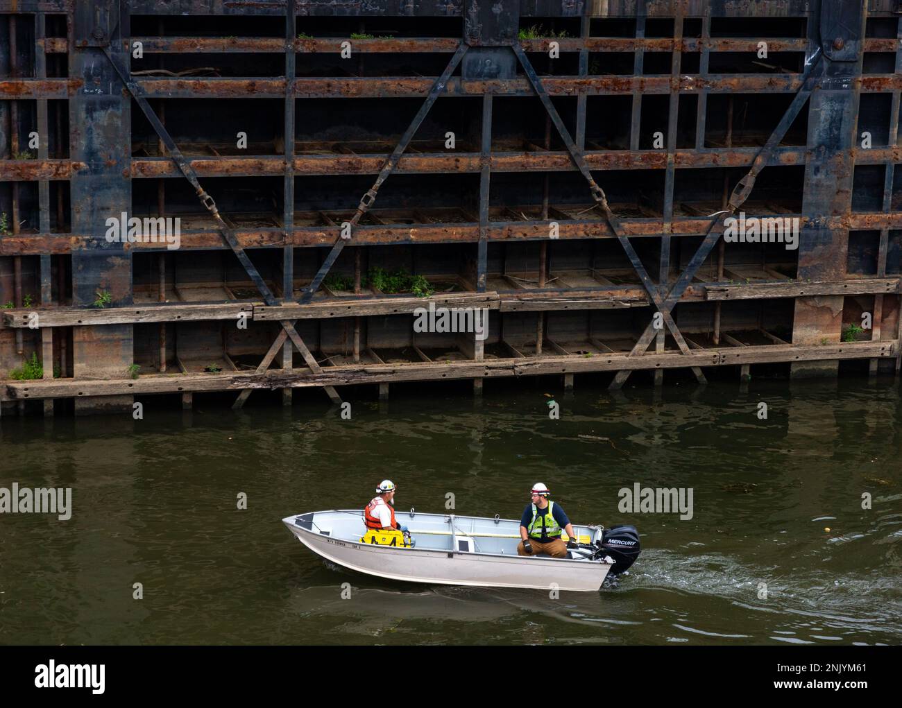 A boat crew with the U.S. Army Corps of Engineers Medium Capacity Fleet ...