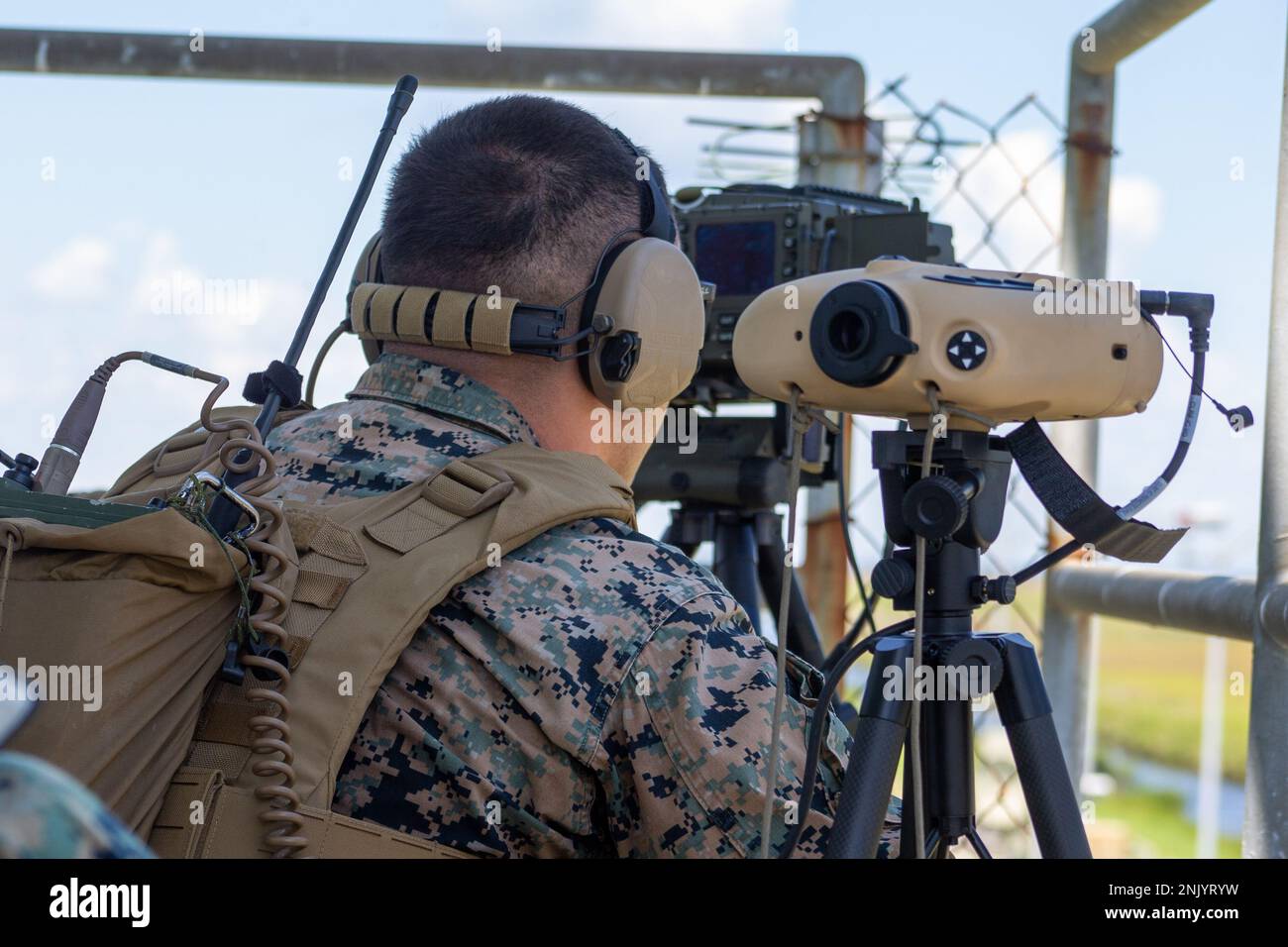 A U.S. Marine assigned to 2nd Reconnaissance Battalion looks through a ...