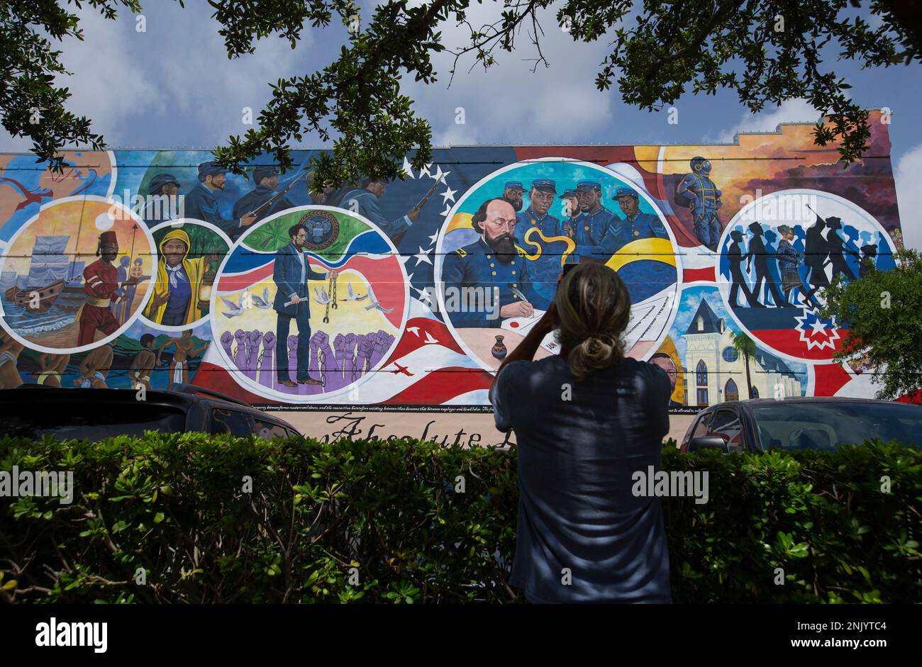 A visitor takes a photograph of the Absolute Equality Mural, which was ...