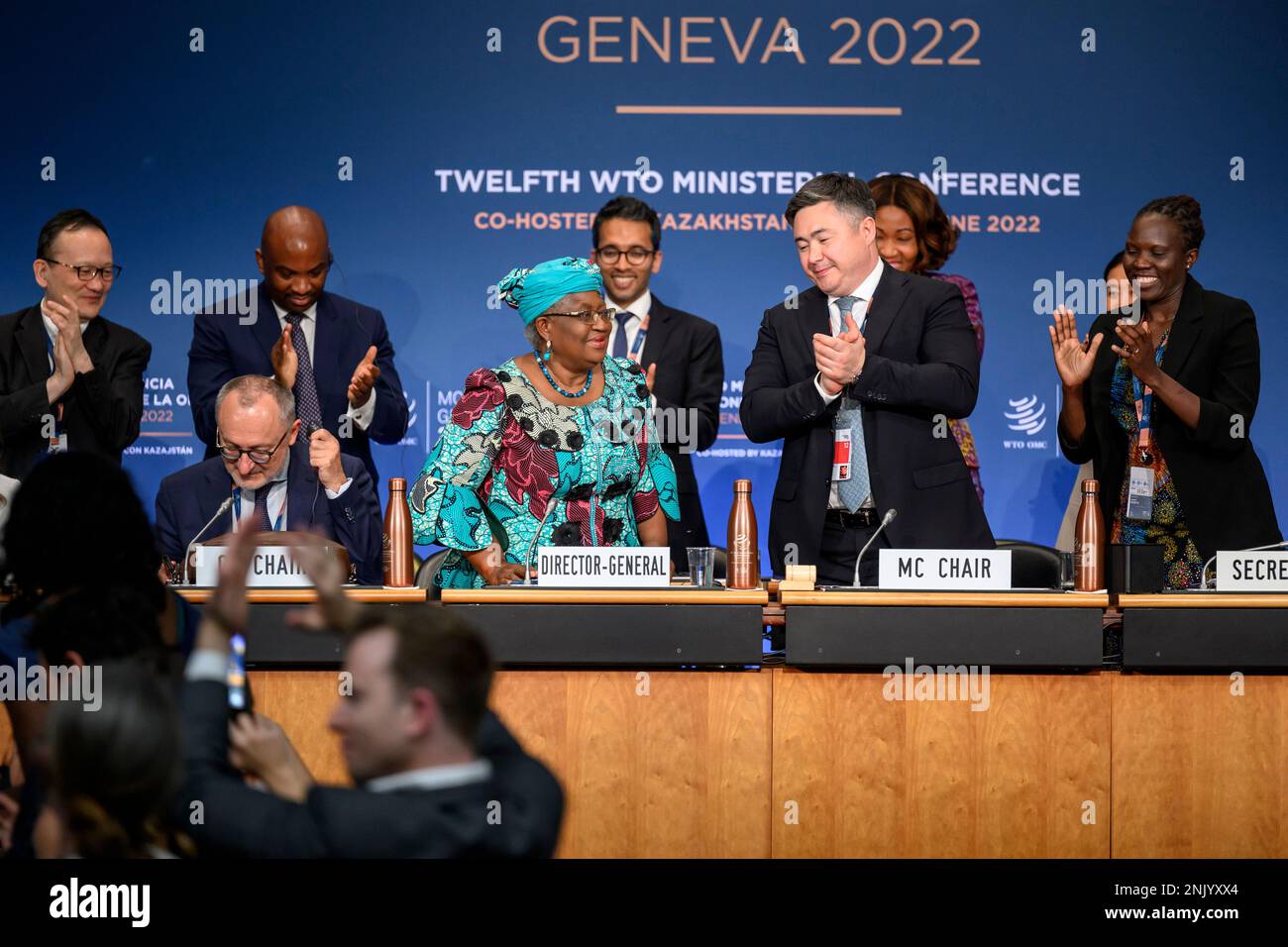 World Trade Organization Director-General Ngozi Okonjo-Iweala, center ...