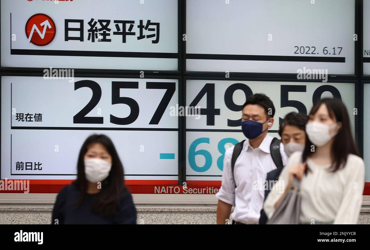 An electric monitor shows the Tokyo Stock Exchange Market plunging over ...