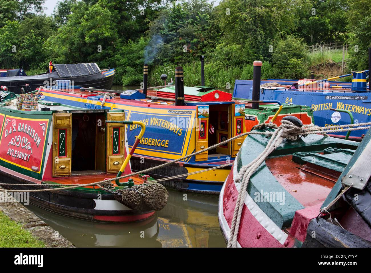 Canal and waterway scene including historic narrowboats, traditional ...