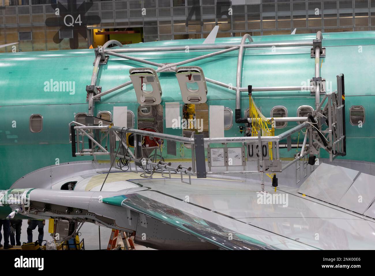 Boeing employees work on the 737 MAX on the final assembly line at ...