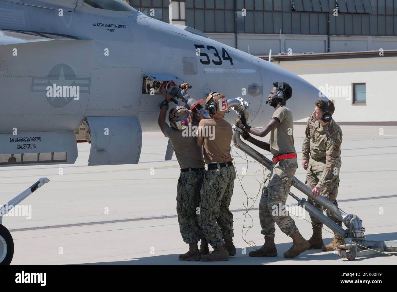 U.S. Navy and Air Force service members assigned to the Electronic ...