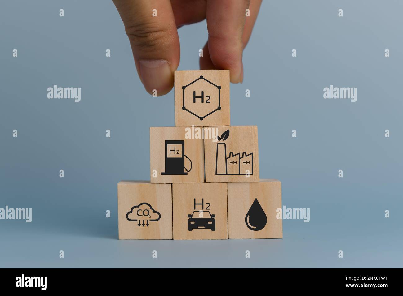 hand holding wood cube.Climate and eco friendly energy in the future ...