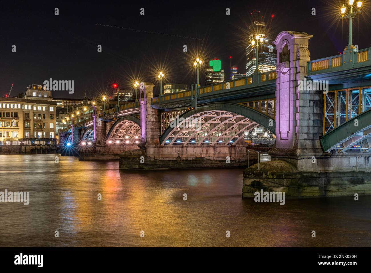 Underneath Southwark Bridge over the River Thames at night, London ...