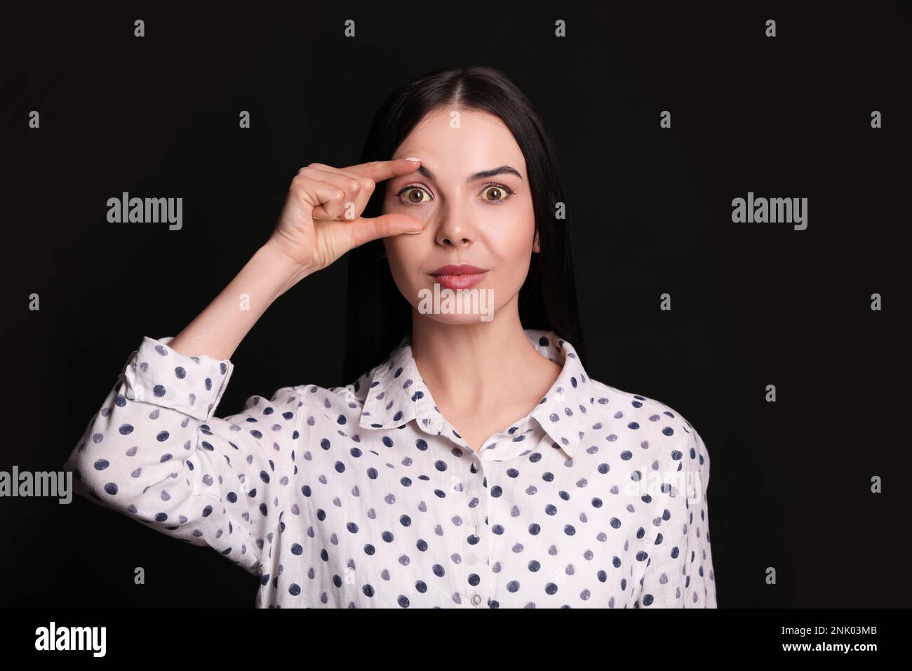 Woman Checking Her Health Condition On Black Background Yellow Eyes As