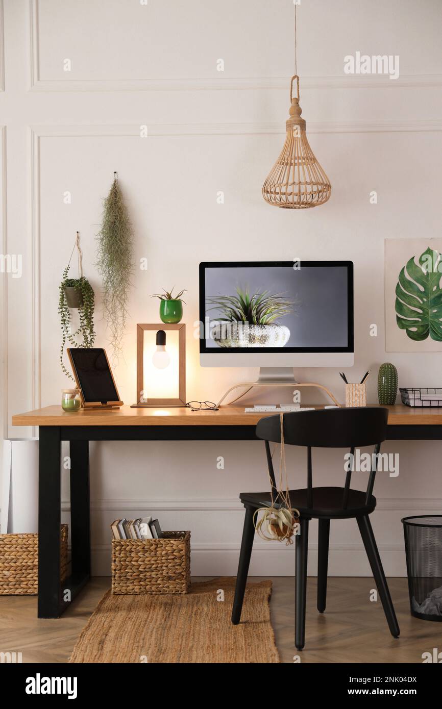 Modern workplace with computer in room. Interior design Stock Photo - Alamy