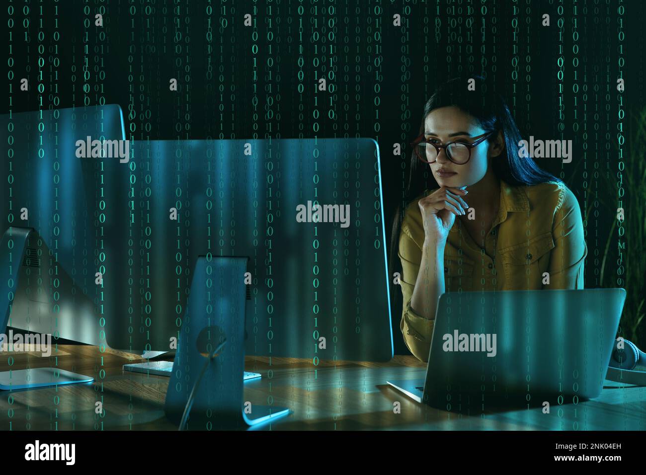 Programmer working in modern office at night Stock Photo - Alamy