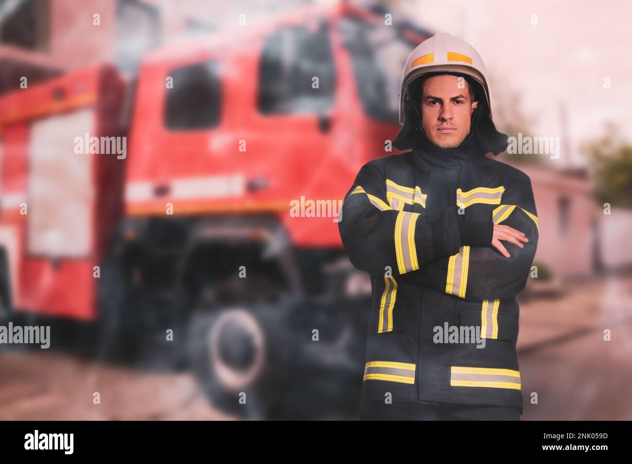 Rescuer wearing uniform and helmet. Professional firefighter Stock ...
