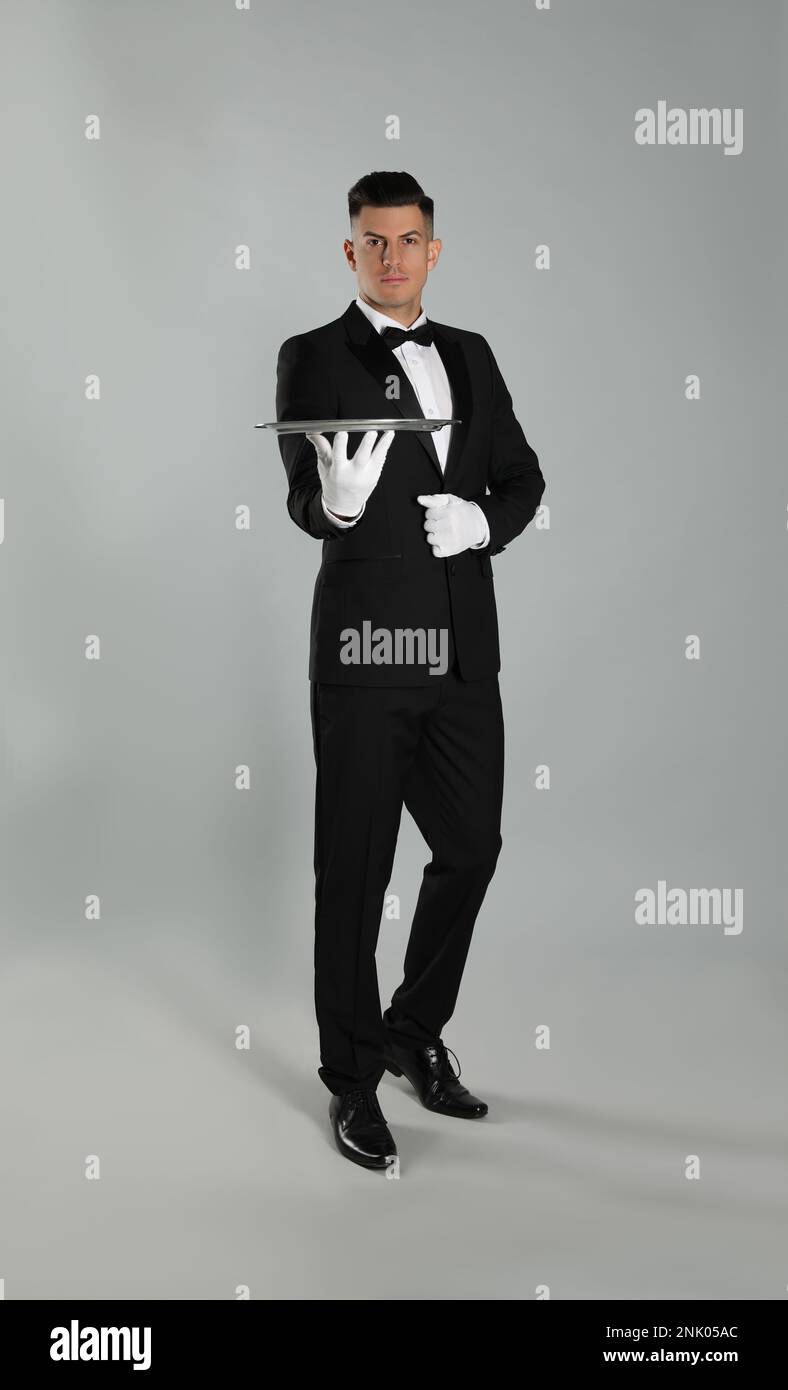 Full length portrait butler bow hi-res stock photography and images - Alamy