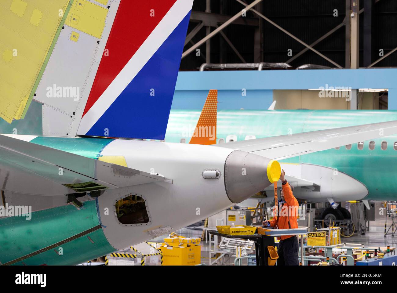 A Boeing employee works on a 737 MAX on the final assembly line at ...