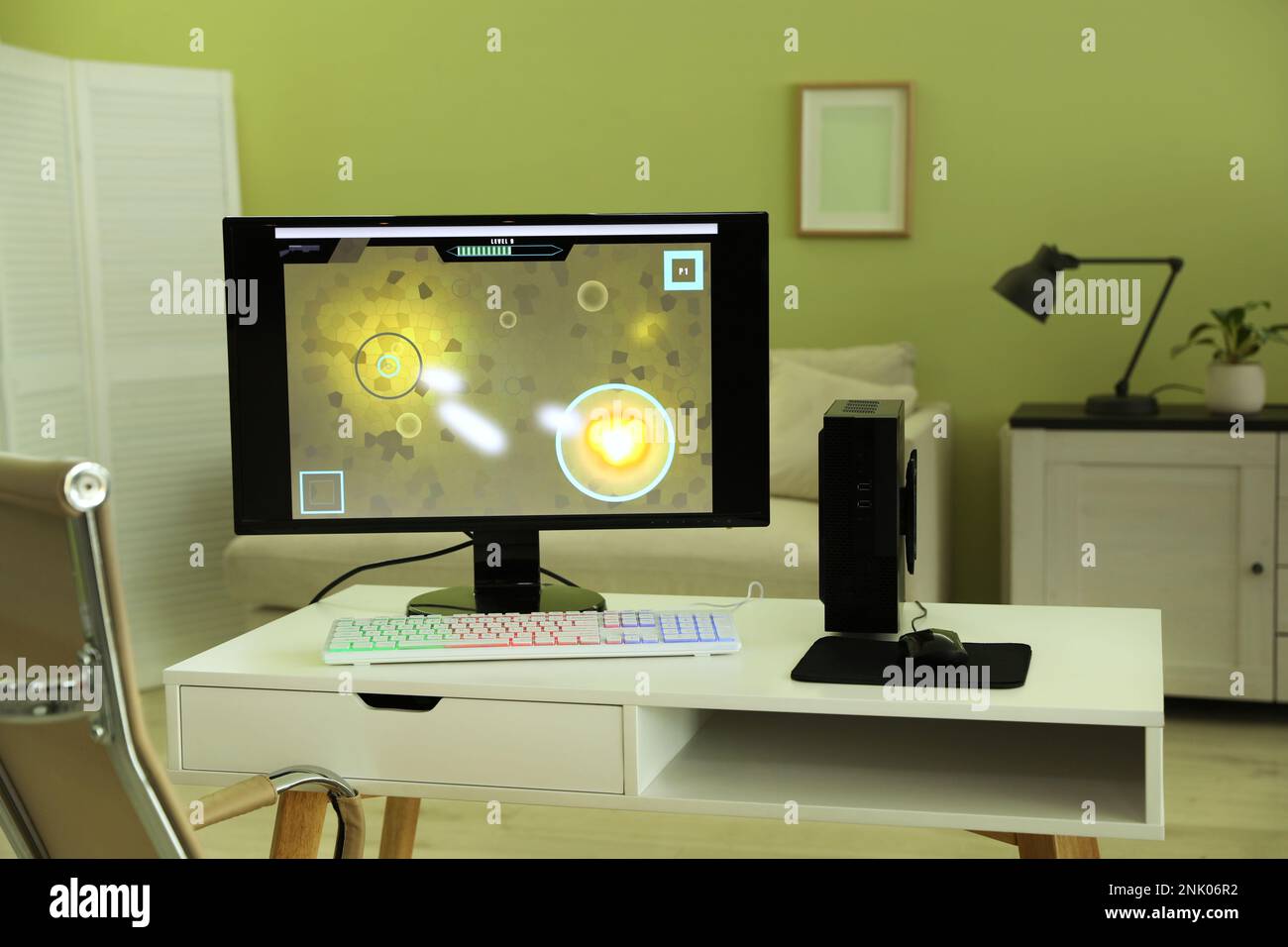 Modern computer and RGB keyboard on white table indoors Stock Photo - Alamy