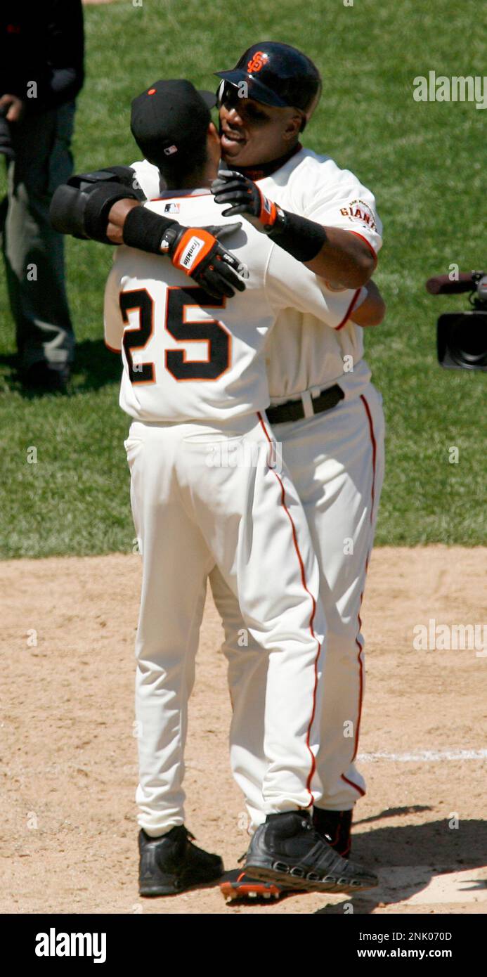 bonds072 ward.jpg Barry Bonds gets a hug from his son serving as Giants ...