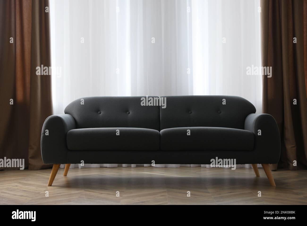 Comfortable grey sofa near window indoors. Interior design Stock Photo ...