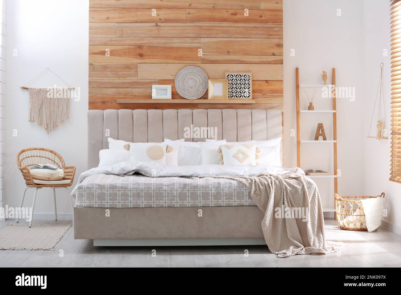 Stylish room interior with big comfortable bed Stock Photo - Alamy
