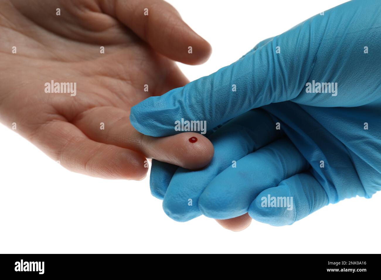 Doctor taking blood sample from patient's finger on white background ...