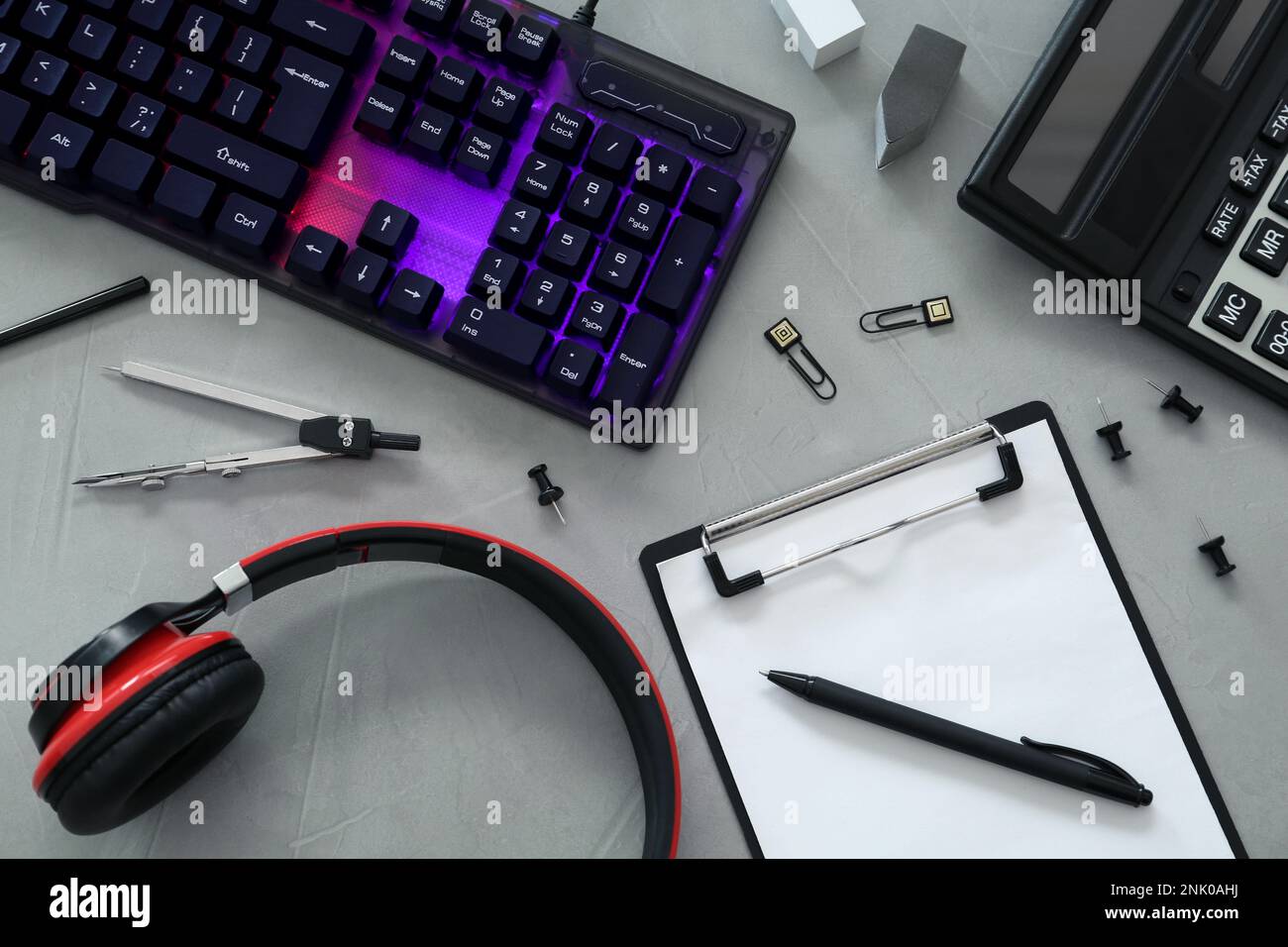 Flat lay composition with modern RGB keyboard on grey table Stock Photo ...