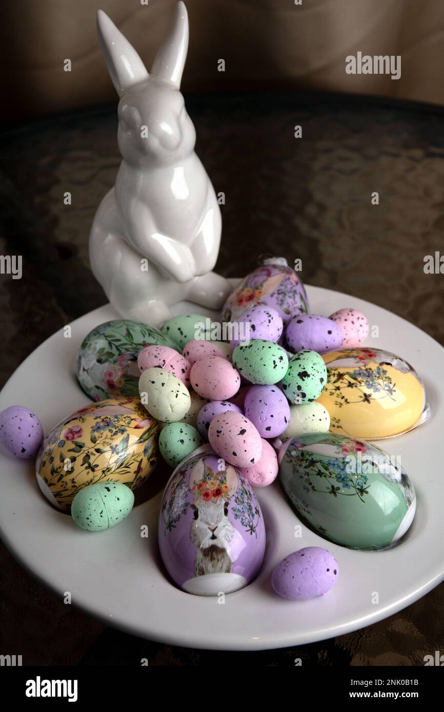 photo of decorative large and small eggs lying on a plate and next to a ...