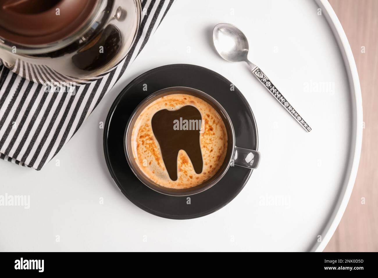 Coffee causing dental problem. Cup of hot drink on table, top view ...