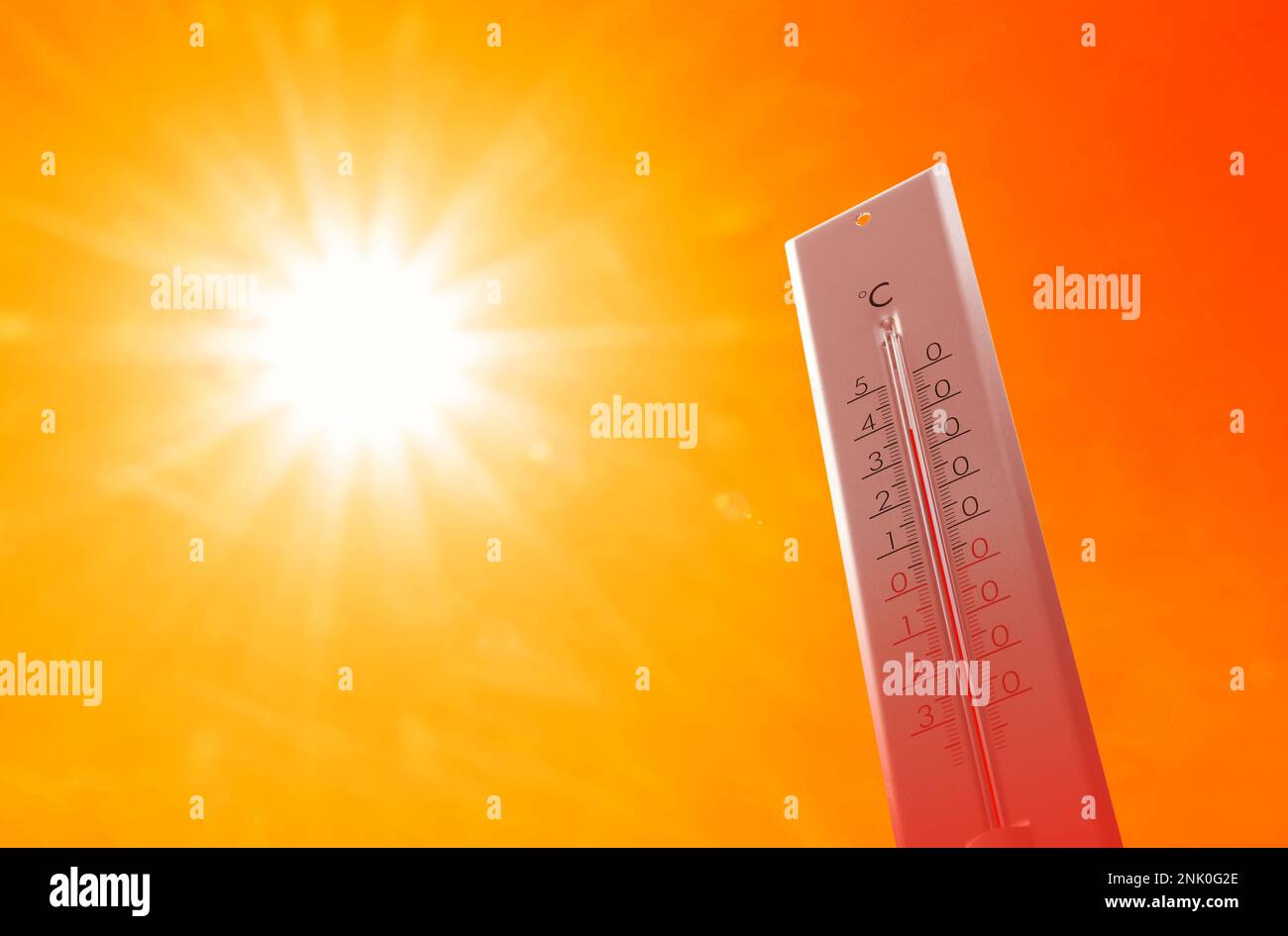 Weather thermometer with high temperature outdoors on hot sunny day ...