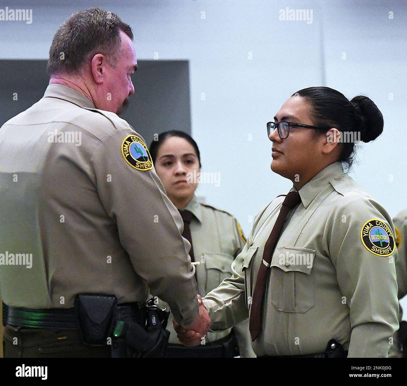 Yuma County Sheriff Leon Wilmot, left, shakes the hand of AWC Detention ...