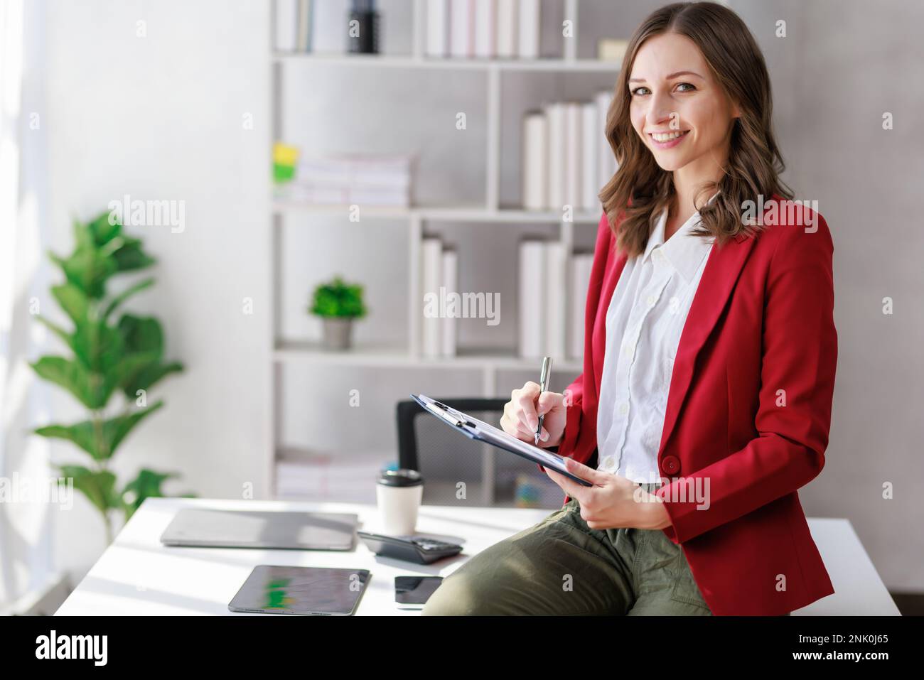 Concept of business working, Businesswoman wearing red suite sitting ...