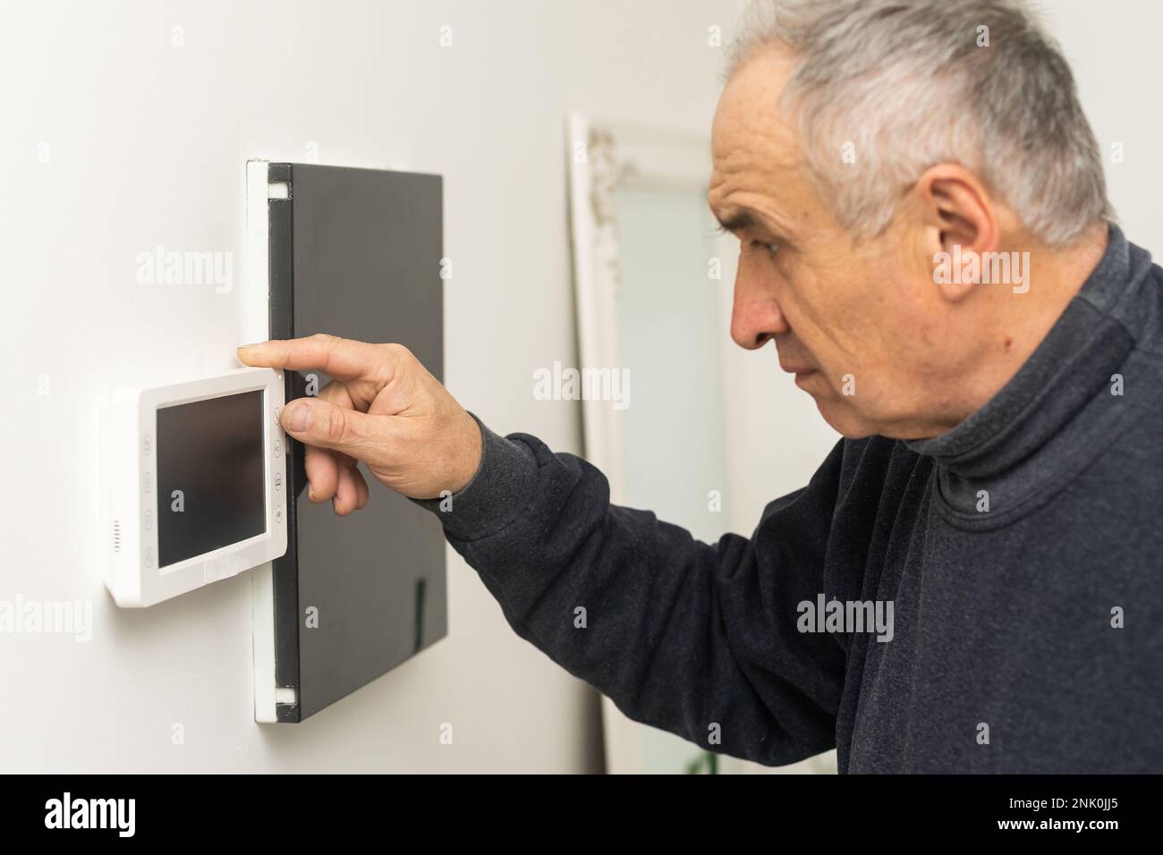 A worker repairs the intercom. Indoor intercom Stock Photo - Alamy