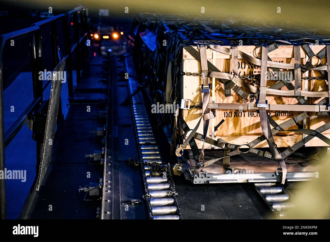 A pallet of Guided Multiple Launch Rocket System munitions prepares to ...