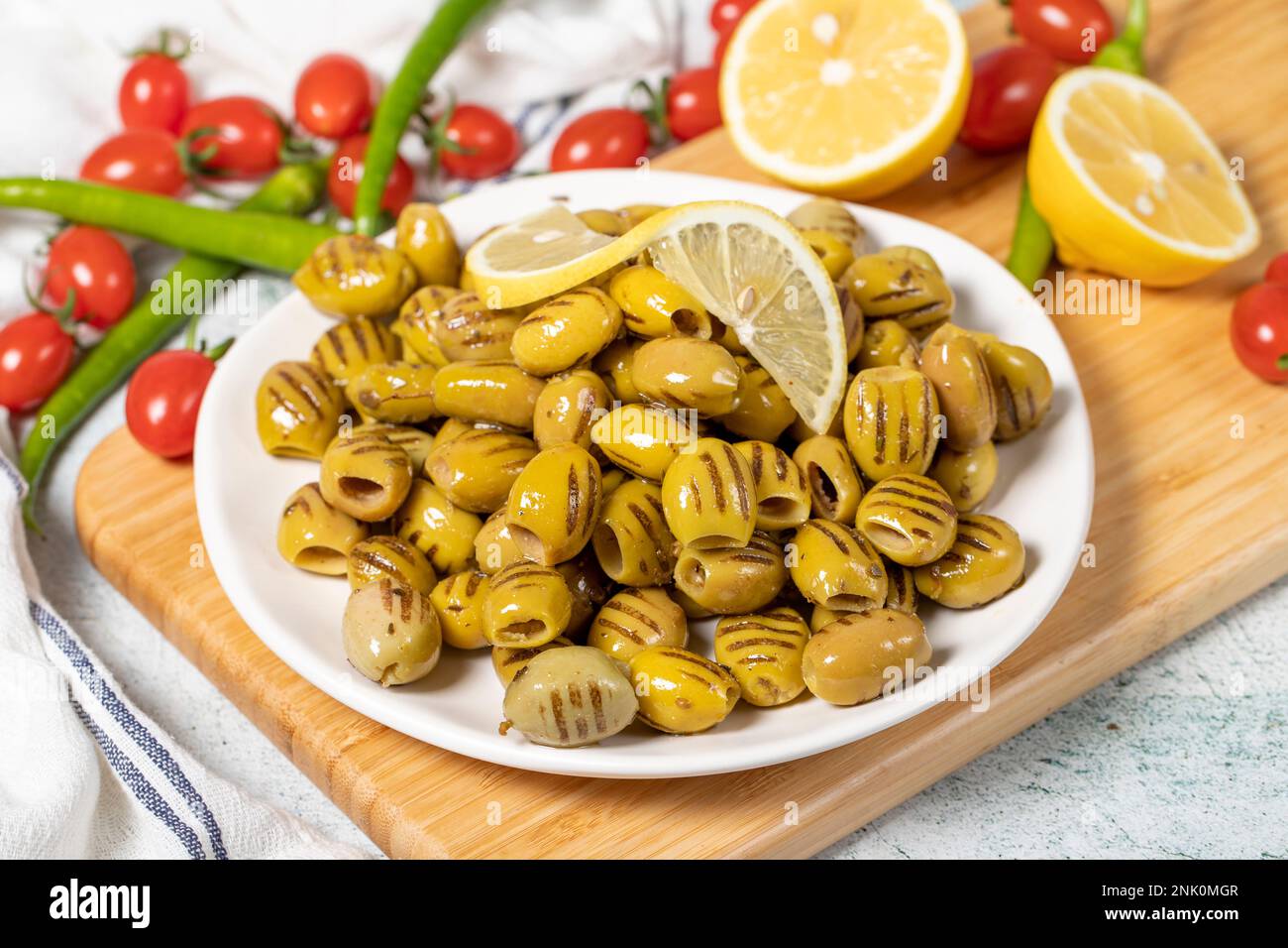 Grilled olives. Tasty Green grilled olives in the plate. Healthy food ...