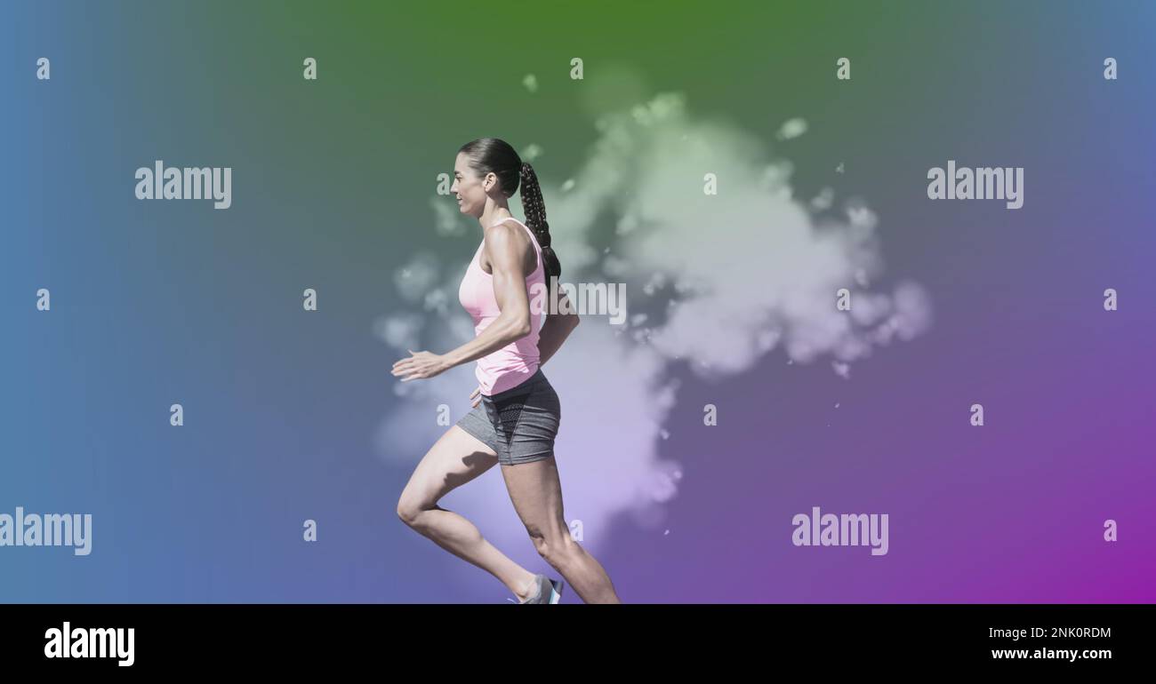 Composition of female athlete running against clouds of smoke on green ...