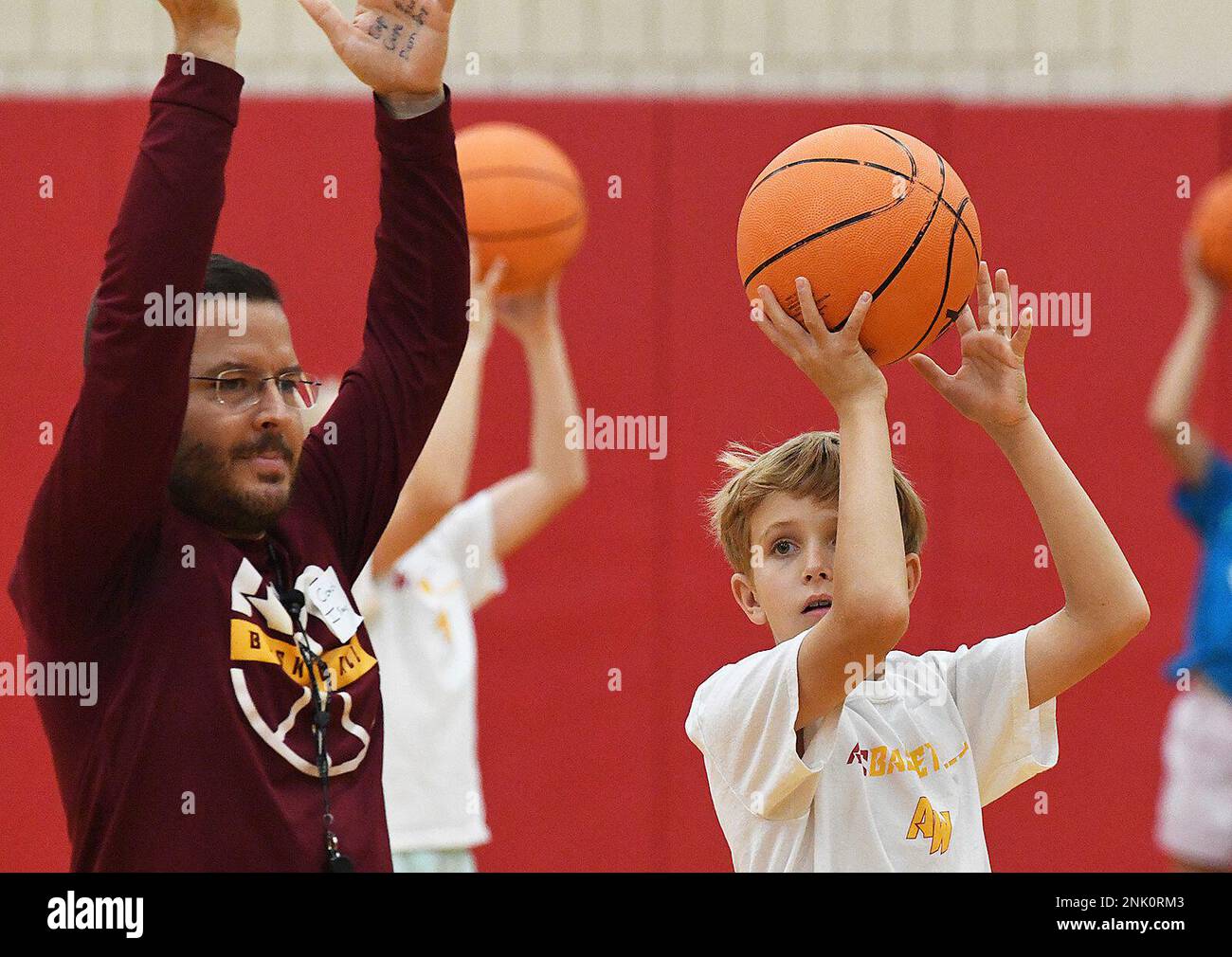 Camper Caden Culpepper, right, keeps an eye on AWC men's basketball ...