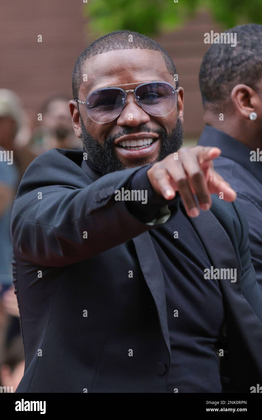 Floyd Mayweather Jr. laughs as he waves to fans during the Champions ...