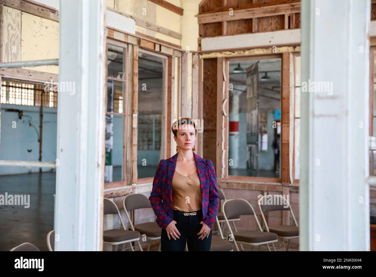 Journalist and artist Sarah Shourd stands for a portrait in a building ...