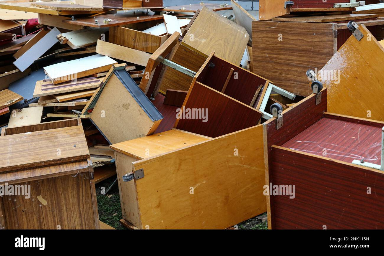 Old broken wooden furniture on waste dump site for recycling, high ...