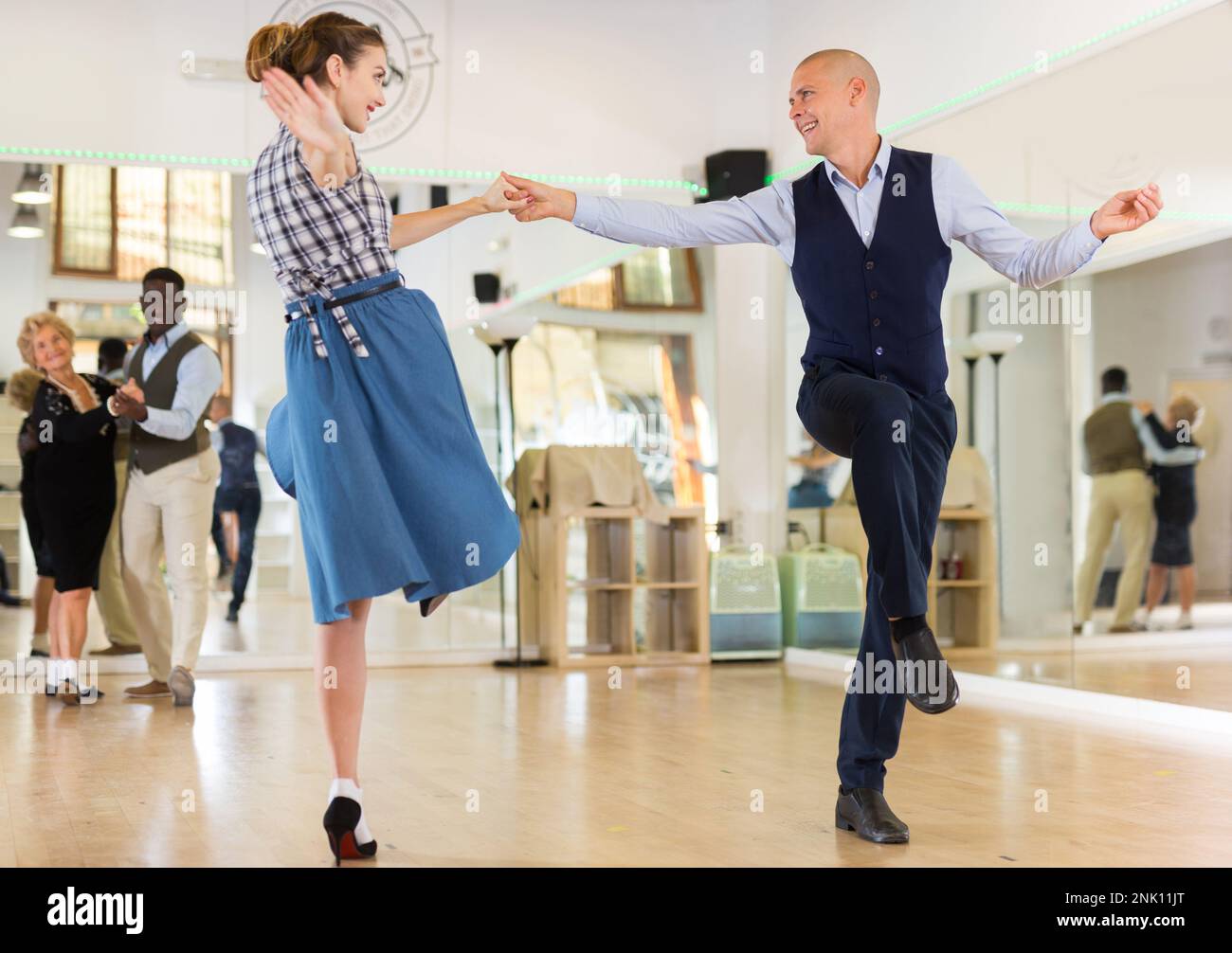 Man and woman performing jazz dance in dancing room Stock Photo - Alamy