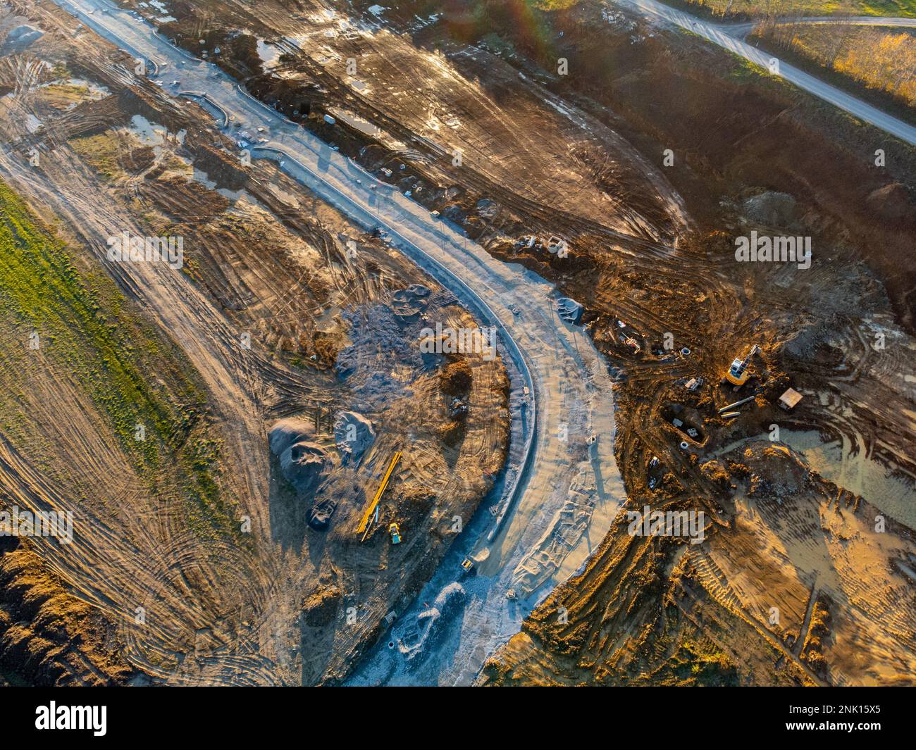 Aerial shot over a construction lot with lots of exposed soil and newly ...