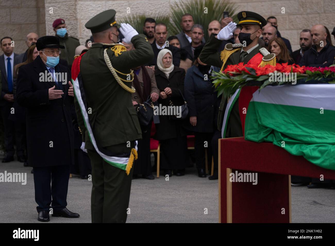 Palestinian President Mahmoud Abbas lays a wreath of flowers at body of ...