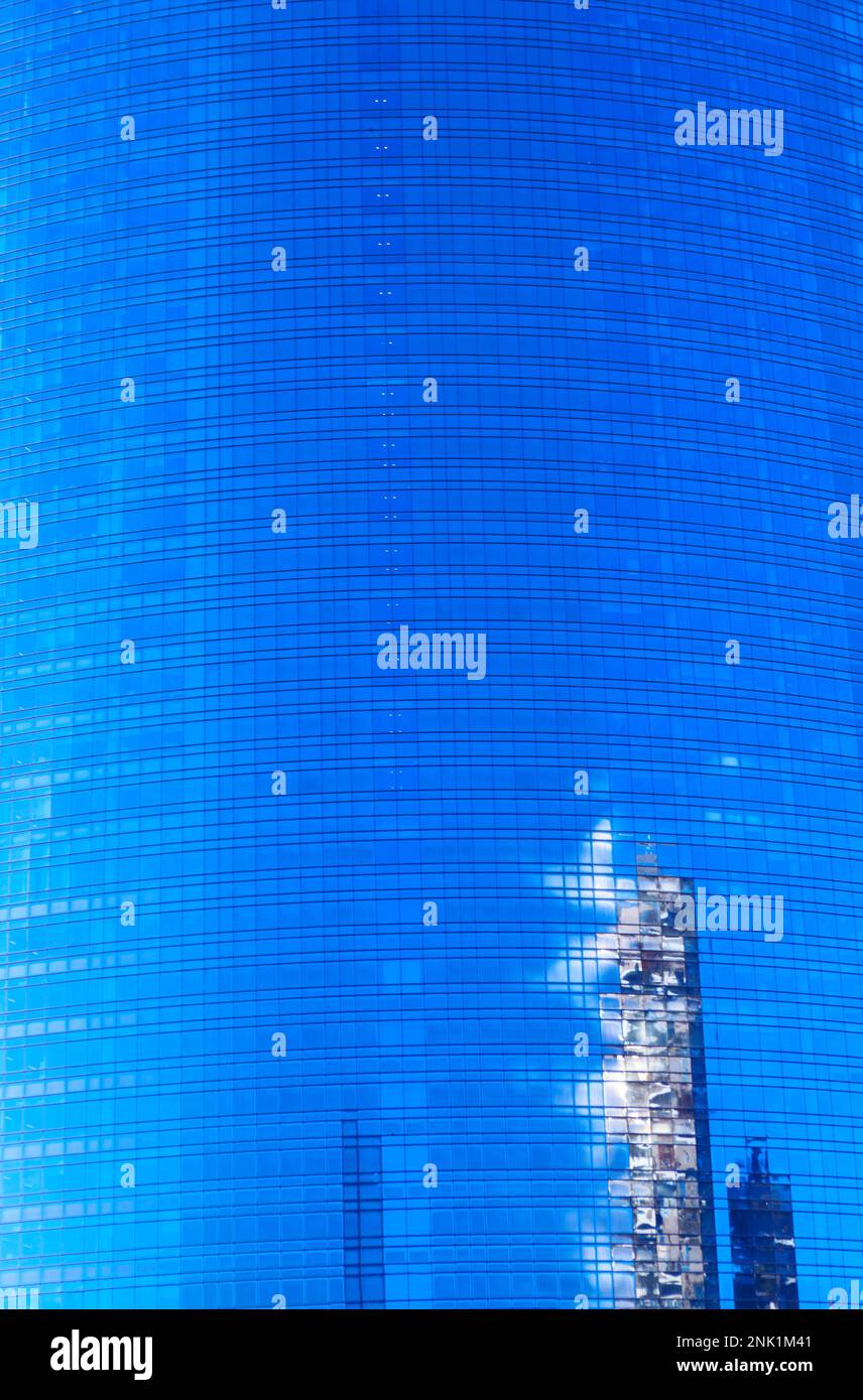 Skyscraper reflected in modern skyscraper glass window architecture ...