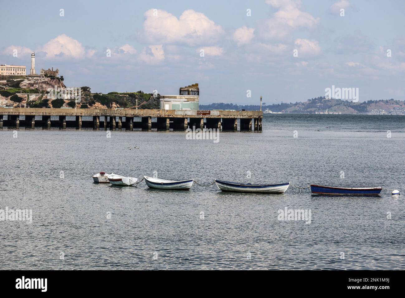 A landscape of Alcatraz Island and sailing ships in San Francisco ...