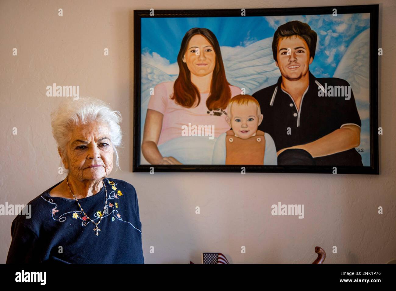 Donna Casasanta poses in front of a painting showing her late son ...