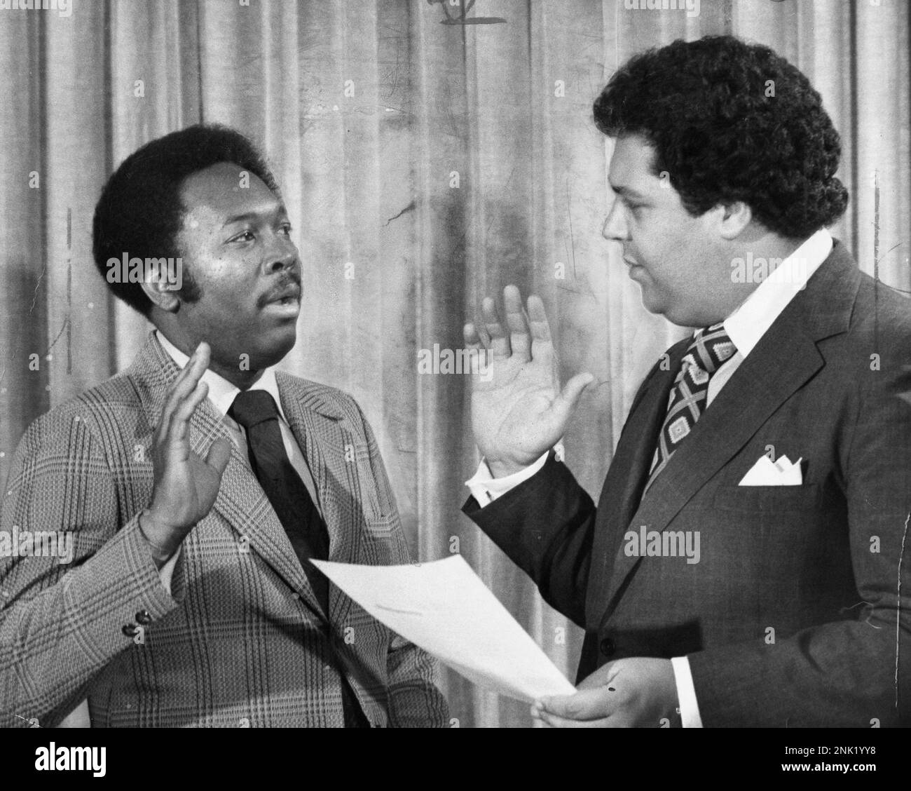 Reginald Eaves, left, takes oath of office from Mayor Maynard Jackson ...