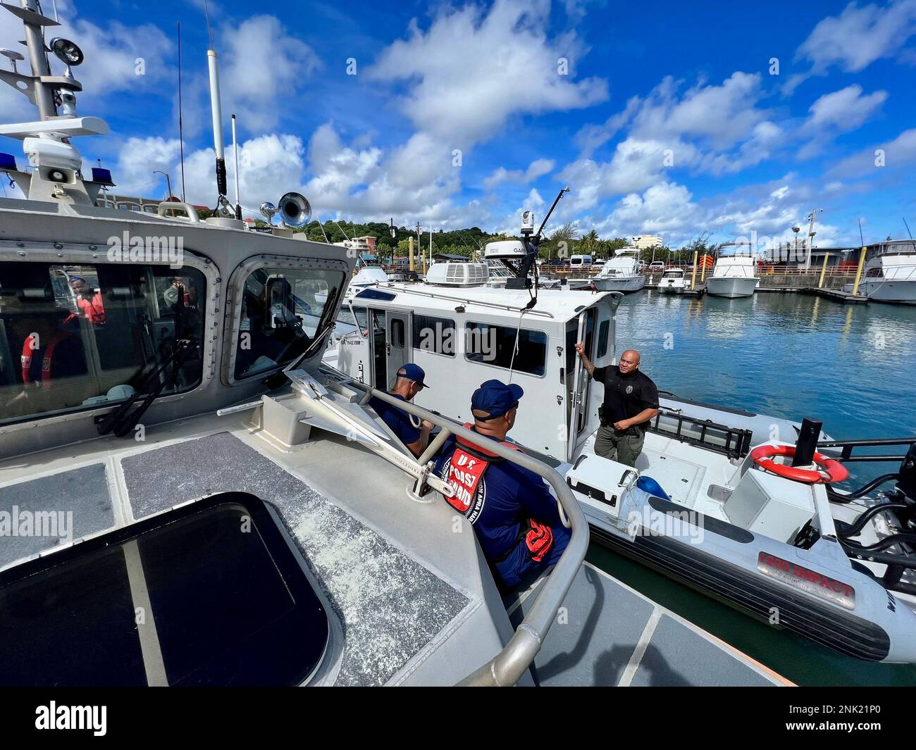 Members of a U.S. Coast Guard Station Apra Harbor 45-foot response boat ...