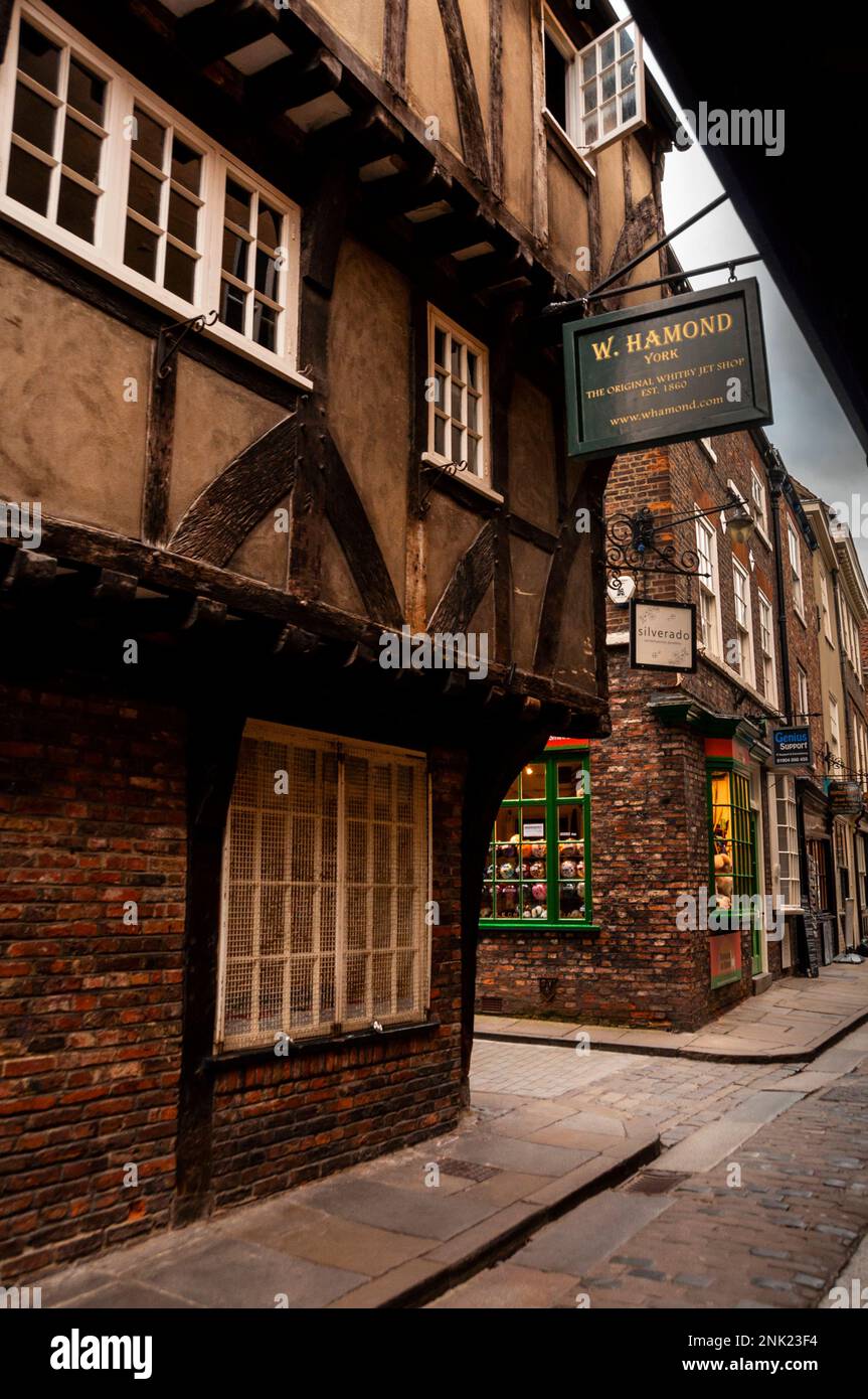 Jettied floors and timber-framed shops in the narrow medieval quarter ...