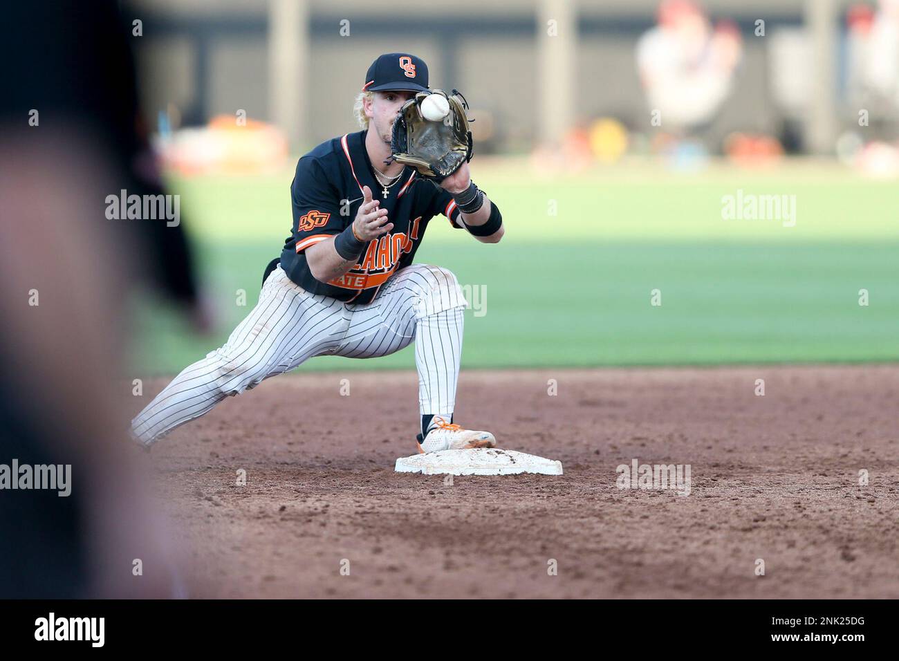 Oklahoma St. utility Roc Riggio (7) fields a throw to second during a ...